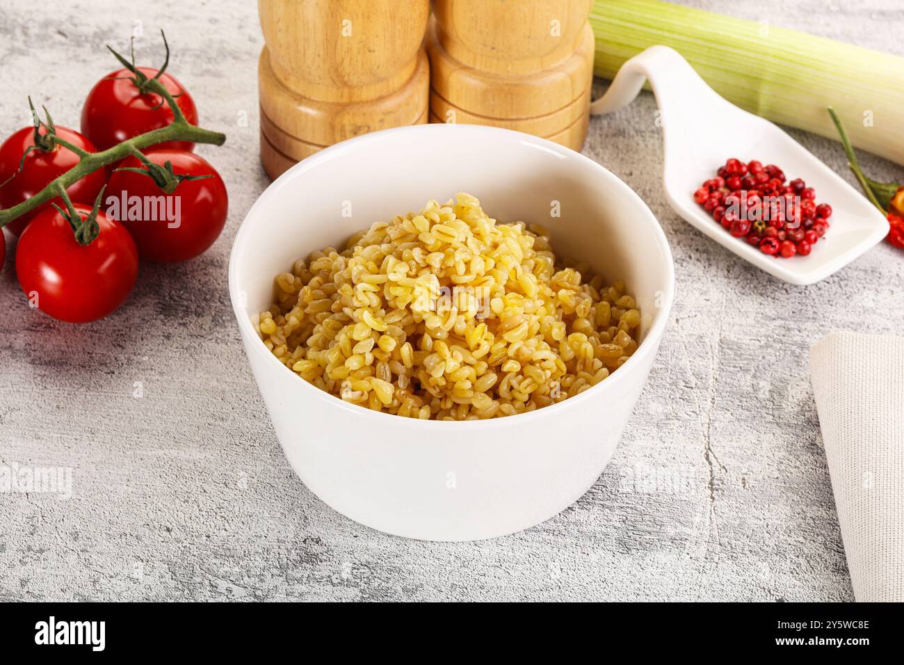 Boiled bulgur wheat in the bowl garnish Stock Photo - Alamy