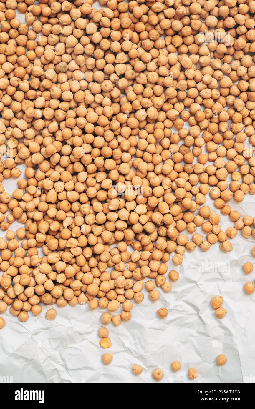 Top view of chick peas on crumpled white paper as background Stock ...