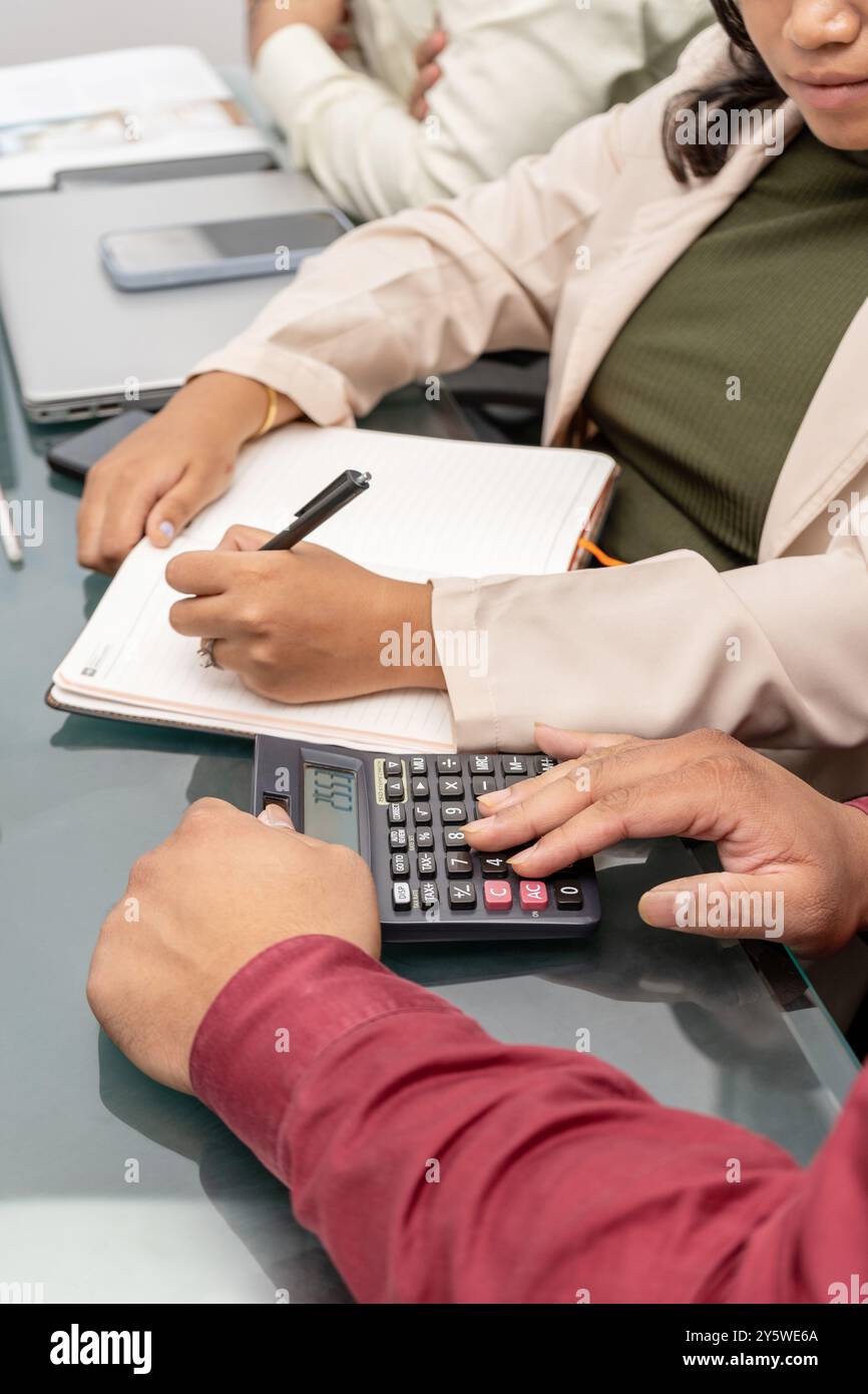 Team professionals collaboratively planning hi-res stock photography ...