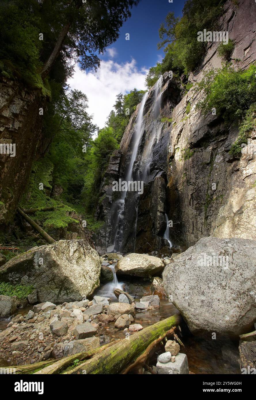 A waterfall crashes on stones Stock Photo - Alamy