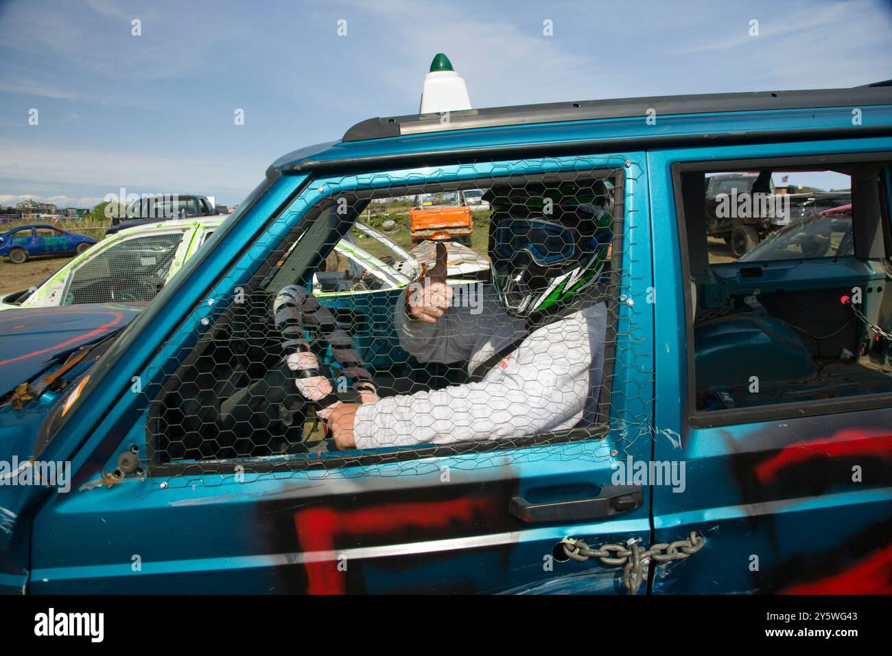 Driver in the Demolition Derby gives a Stock Photo - Alamy
