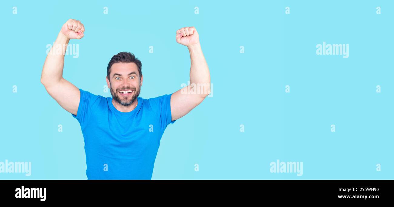 The winner. Successful man raising arms. Excited man with arms up ...