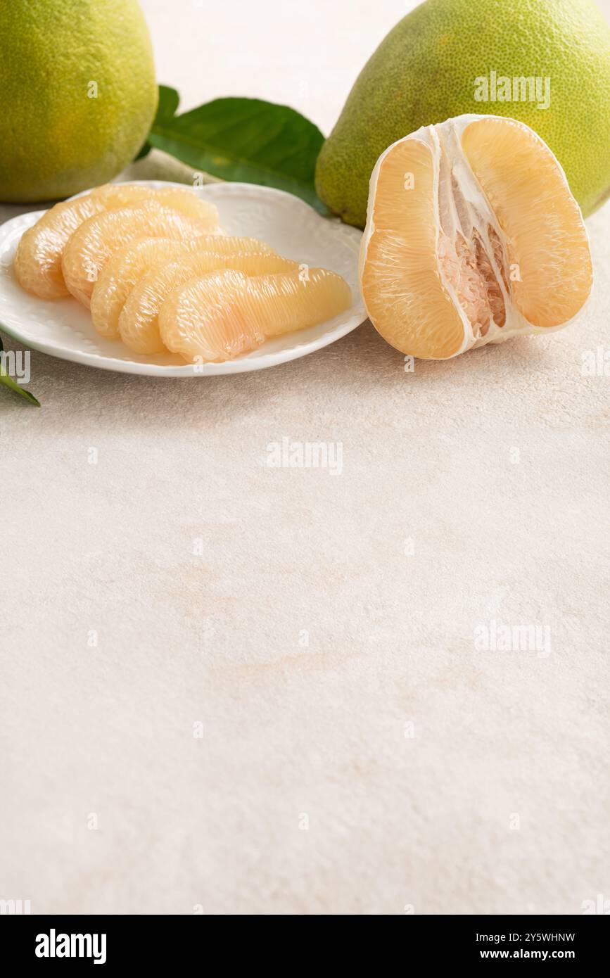 Fresh peeled pomelo with leaf on white table background for Mid-Autumn ...