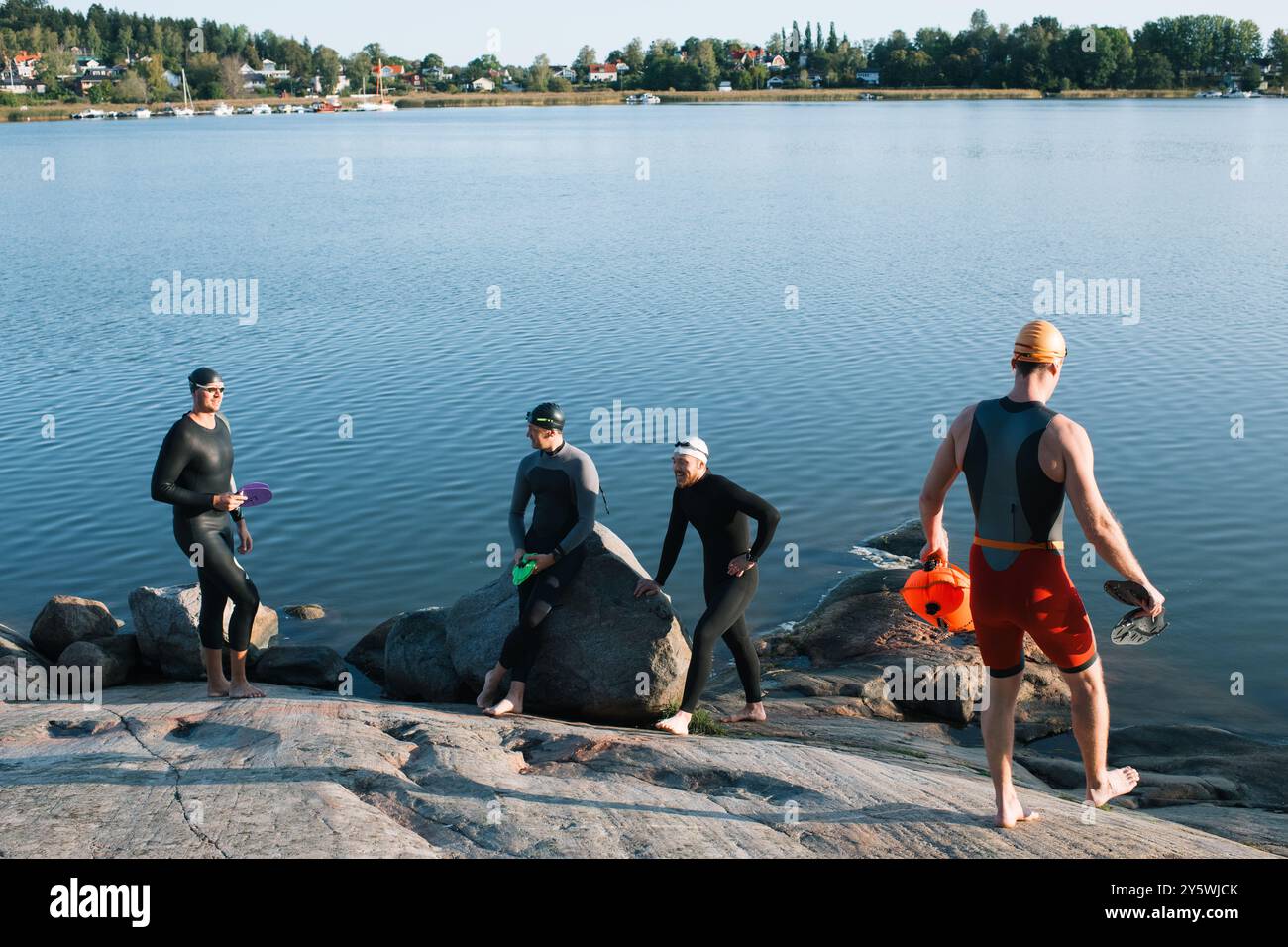 Scandinavian men getting ready to swim in the baltic sea with friends ...