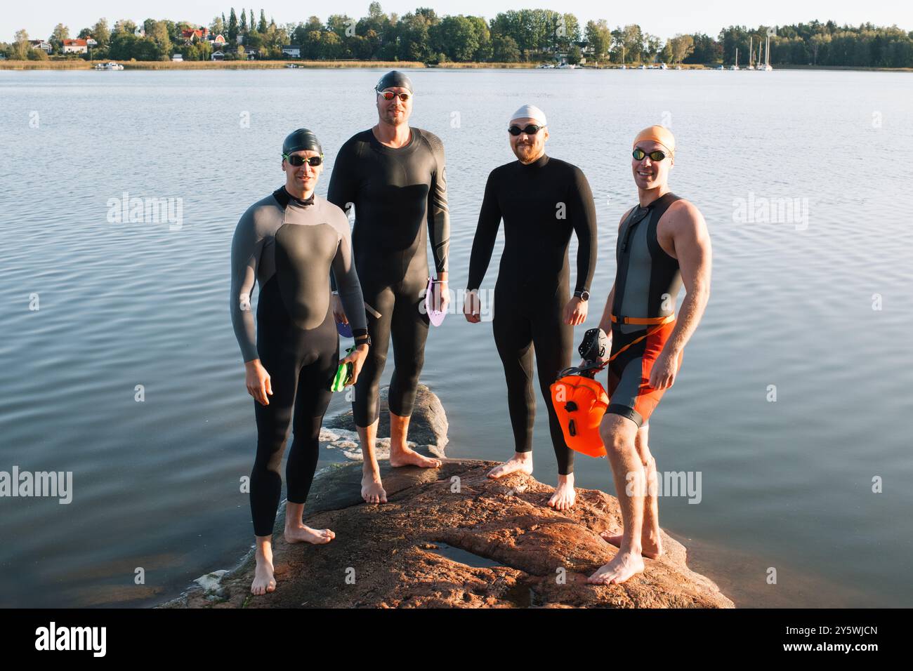 Swedish men stood on a rock ready to swim in the baltic sea Stock Photo ...