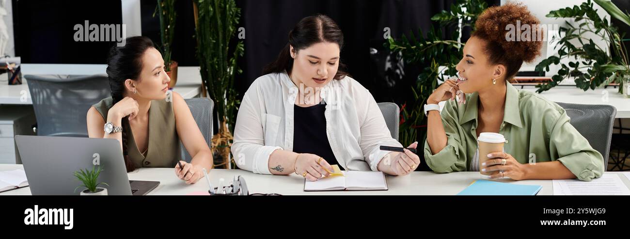 Three professional women in a modern office brainstorm ideas during a ...