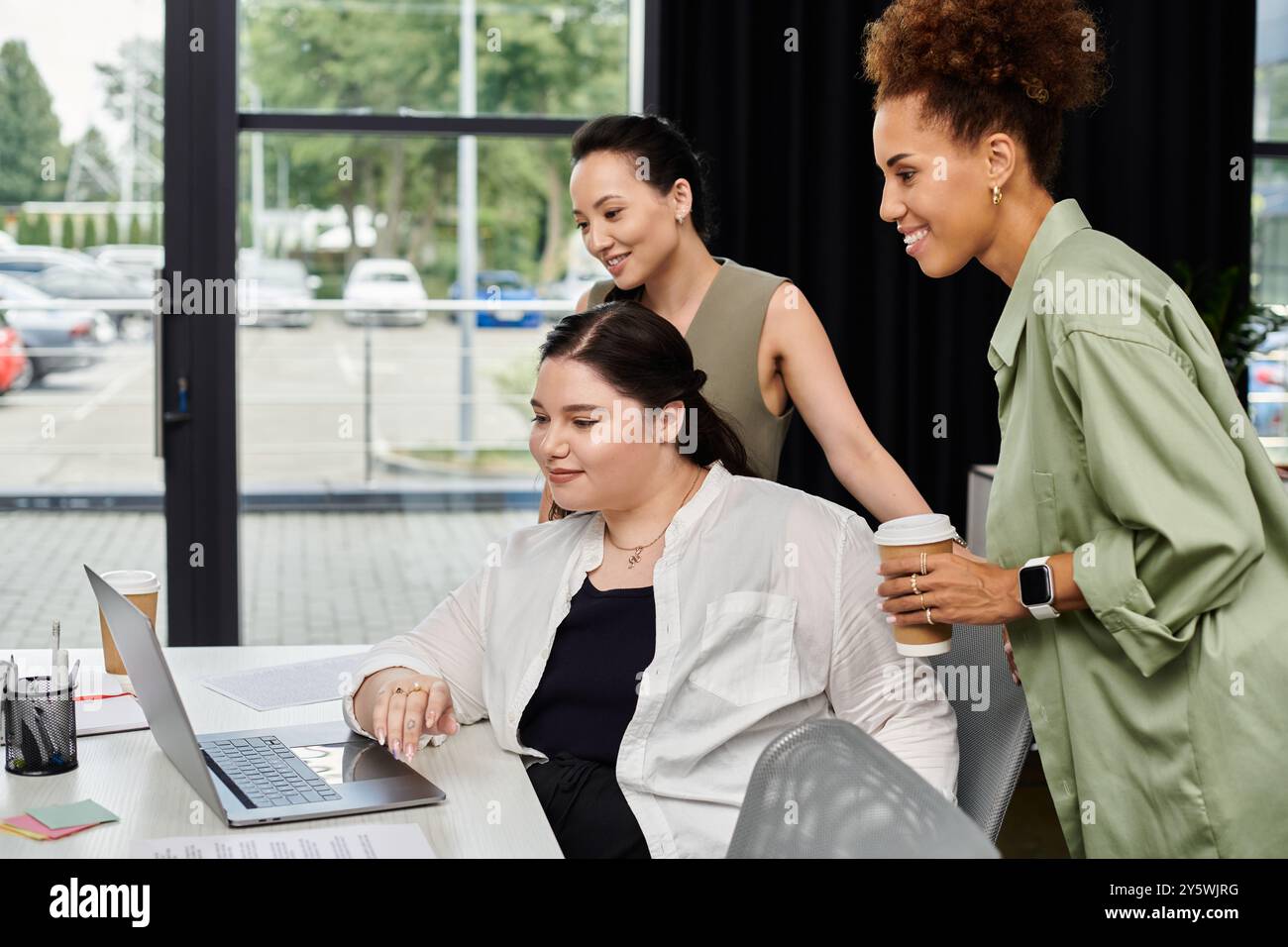 Group of successful women in business attire discussing ideas and ...