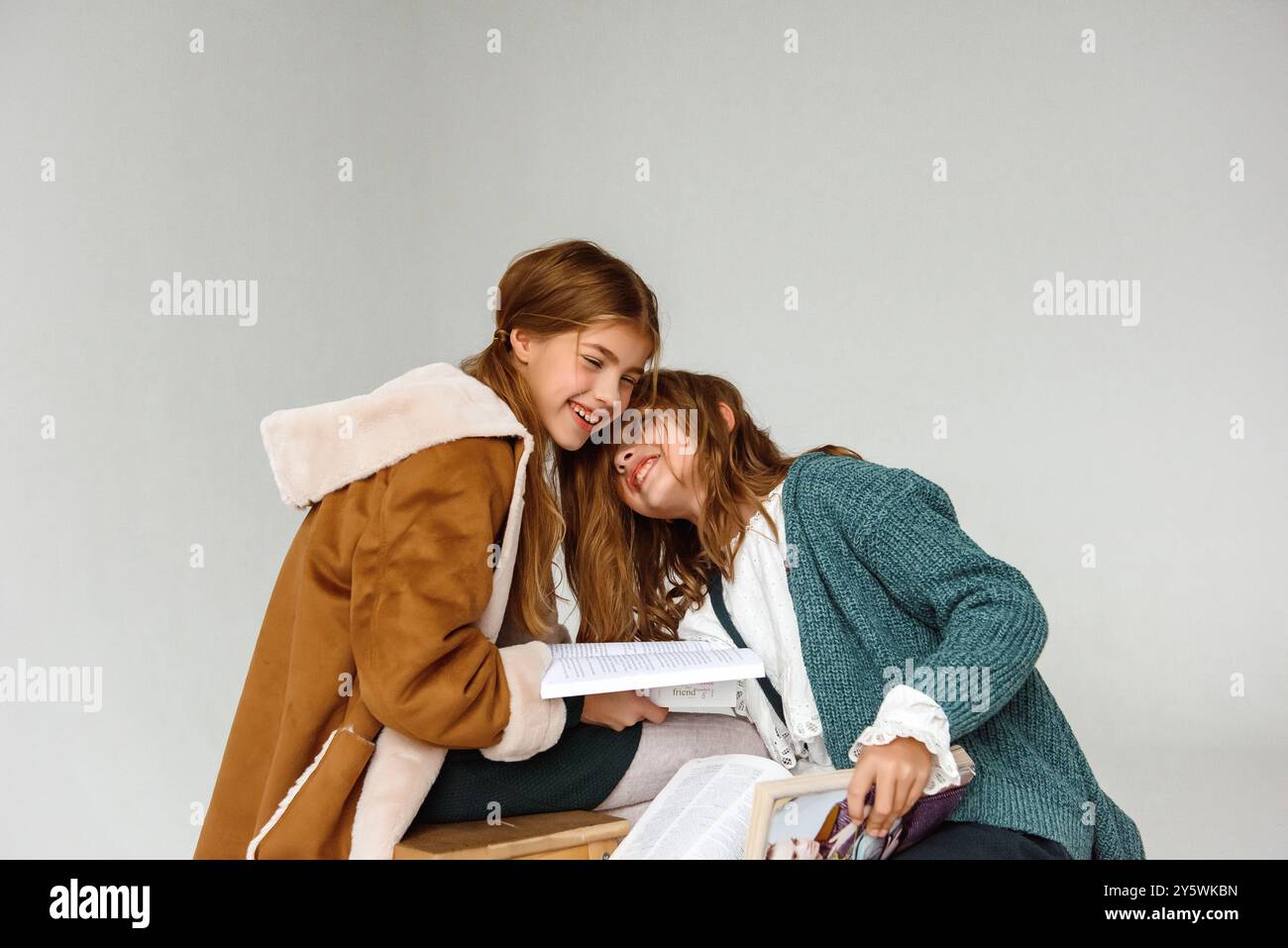 Two schoolgirls with books, first grade Stock Photo - Alamy
