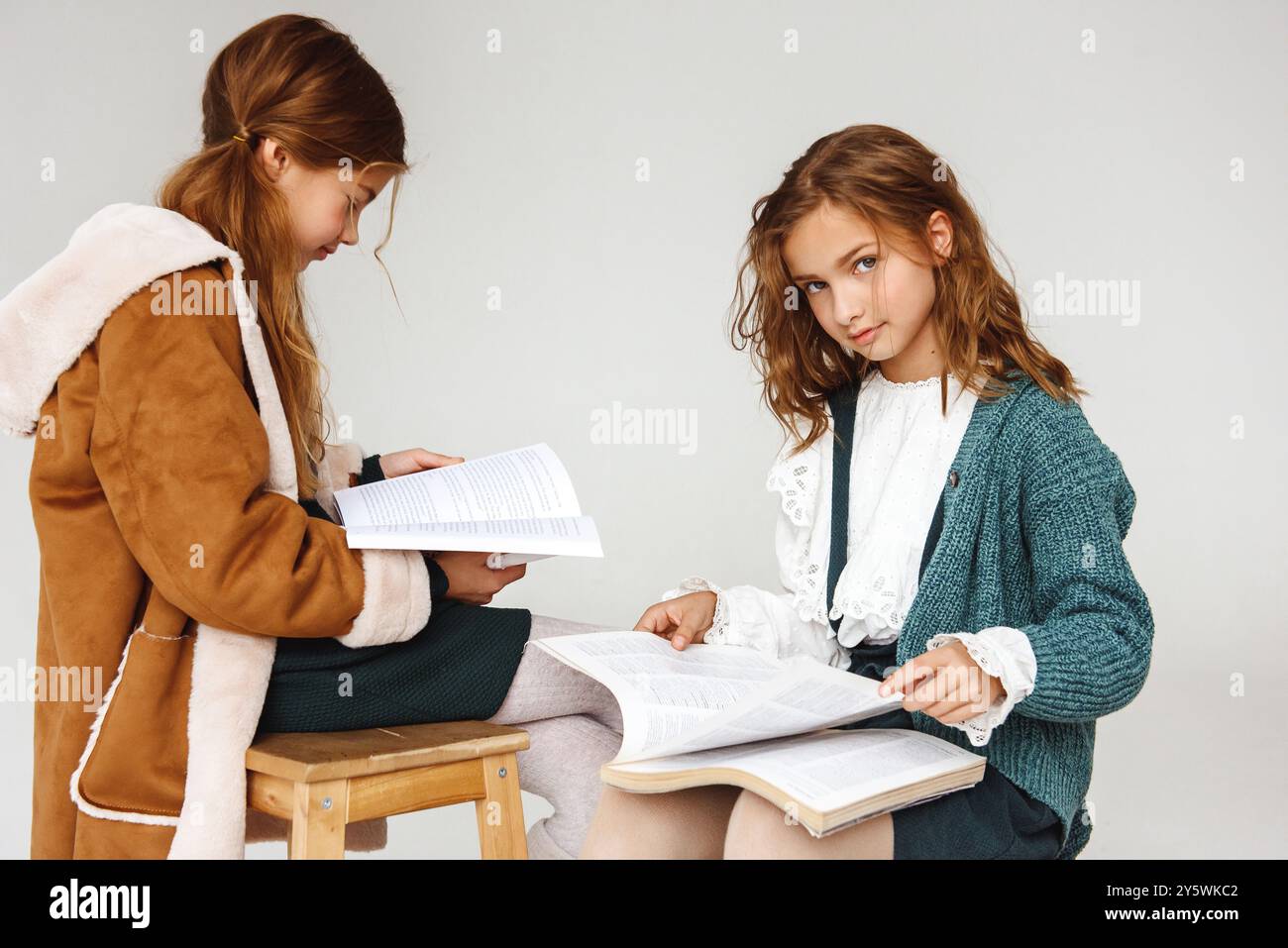 Two schoolgirls with books, first grade Stock Photo - Alamy