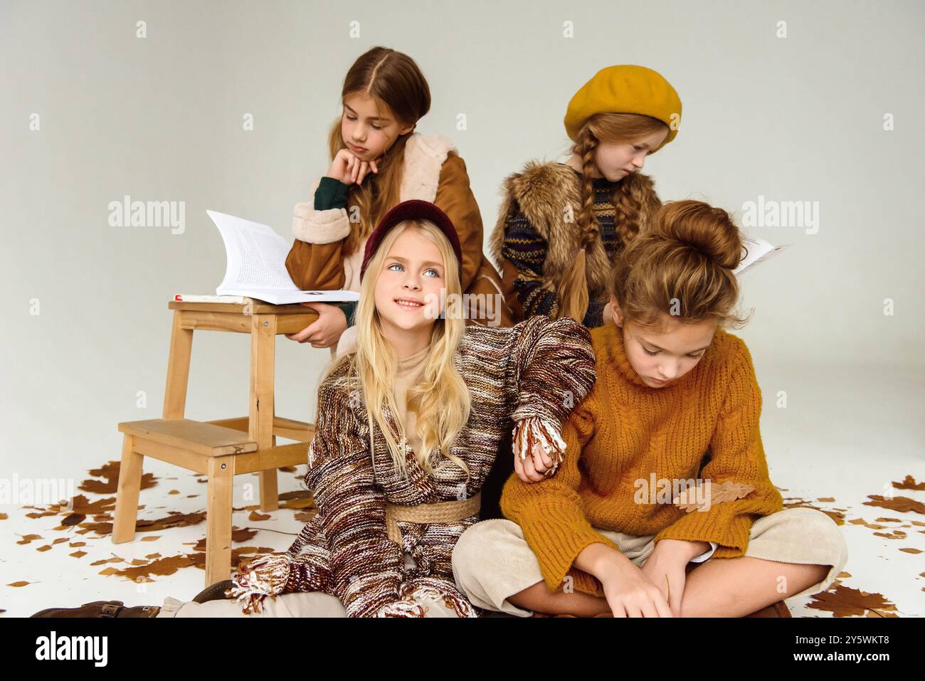 Four schoolgirls with books, first grade Stock Photo - Alamy