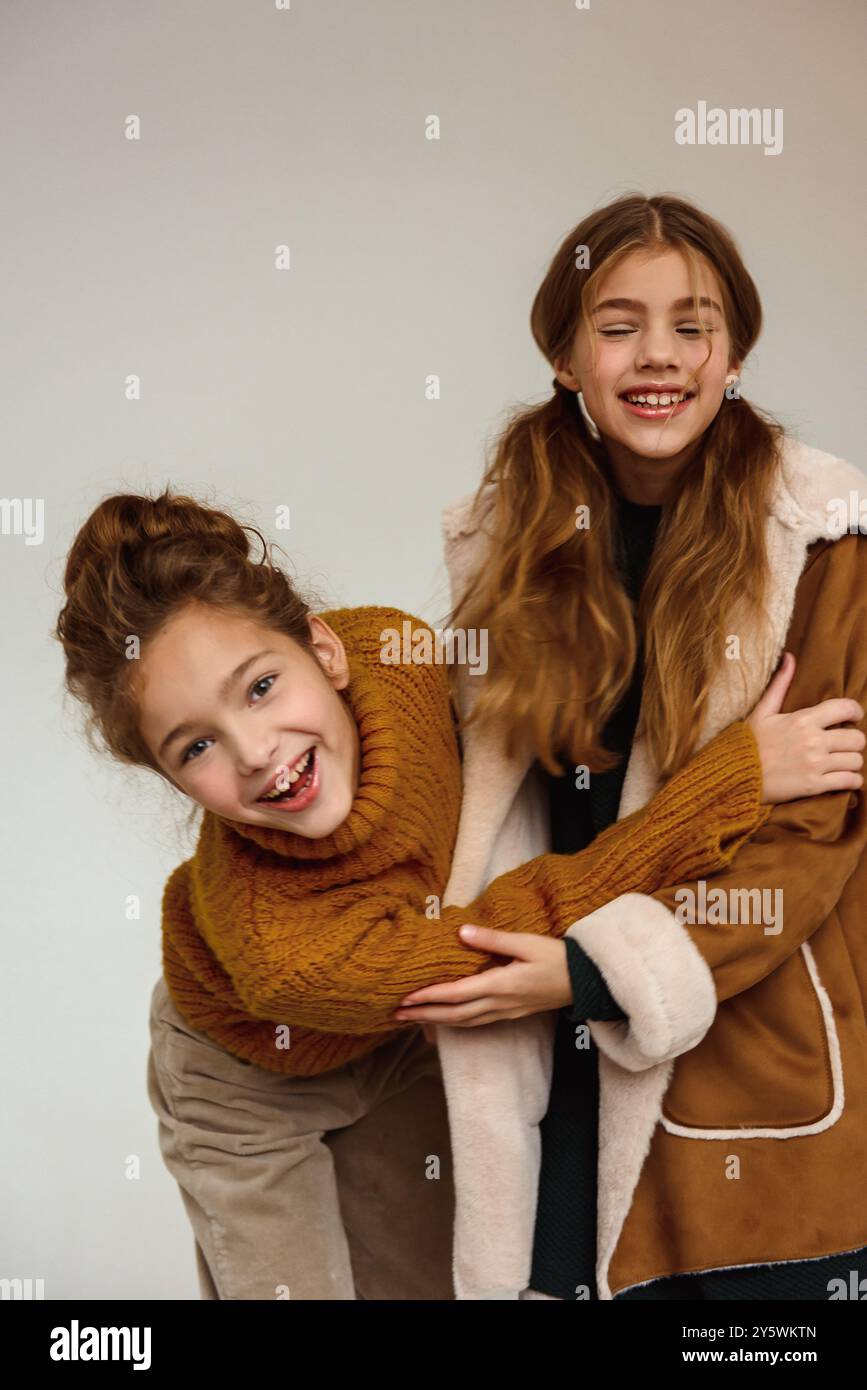 Girls friends laugh and hug Stock Photo - Alamy