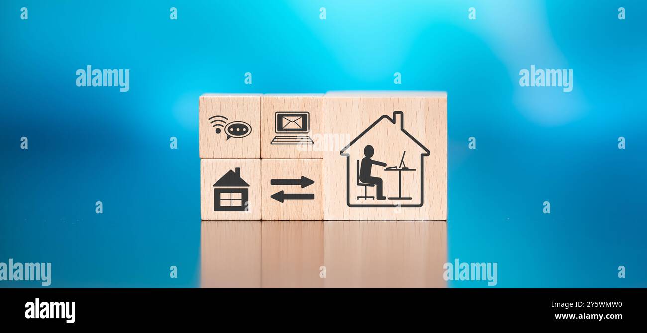 Wooden blocks with symbol of work from home concept on blue background ...