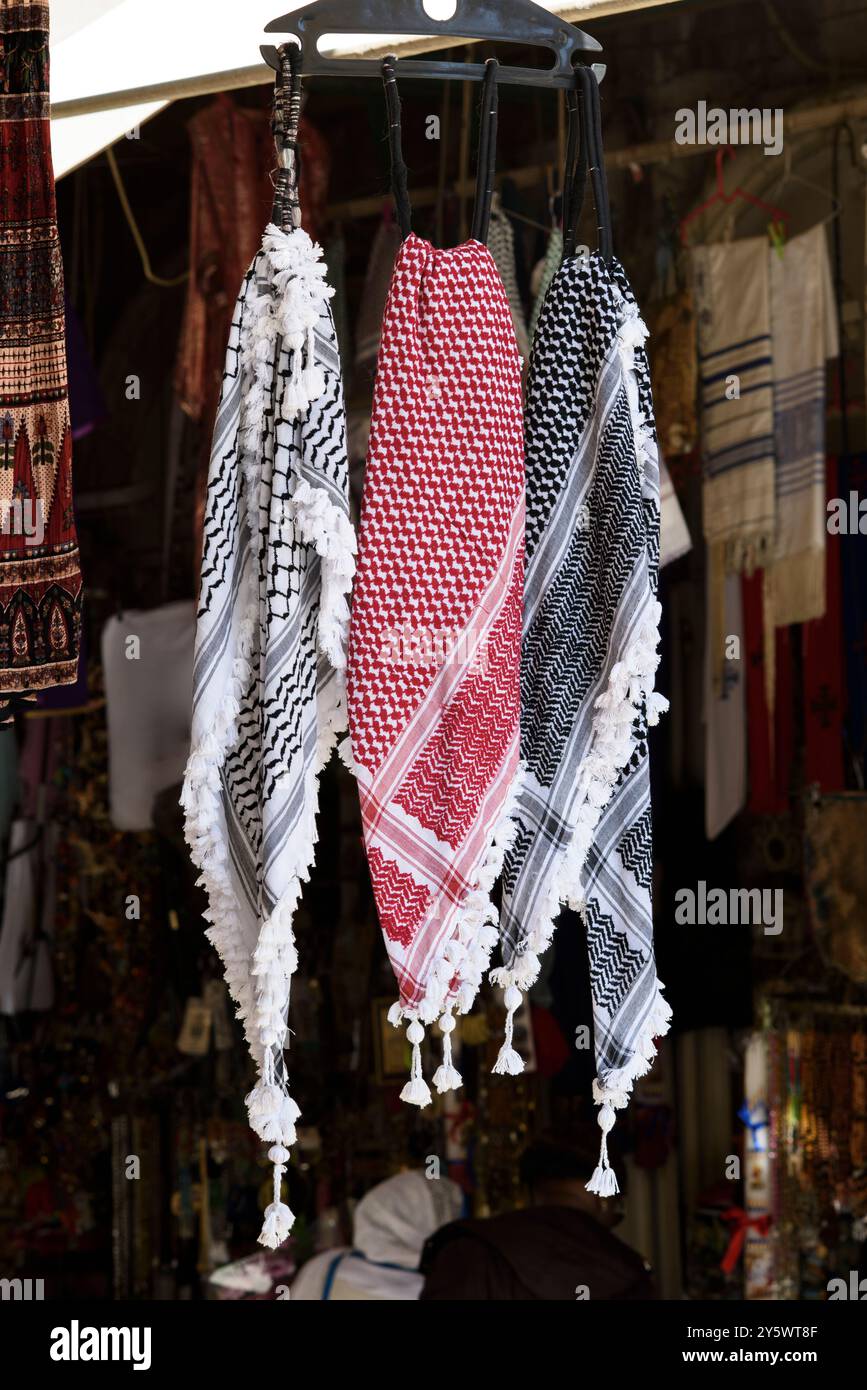 The keffiyeh or kufiyyeh, a traditional headdress worn by men from ...
