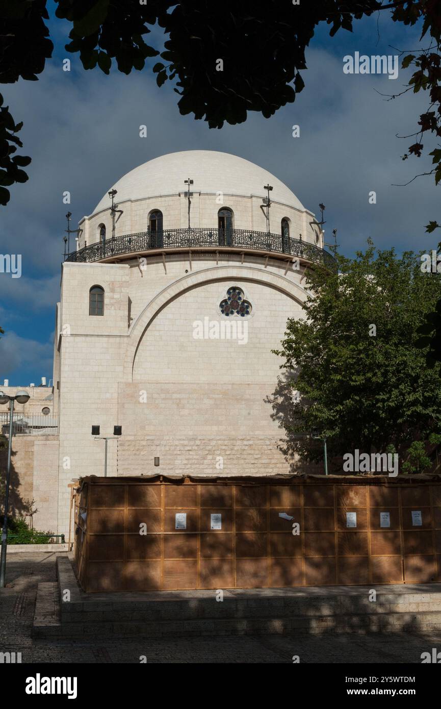 Exterior view of the Hurva Synagogue and a large, temporary sukkah, in ...
