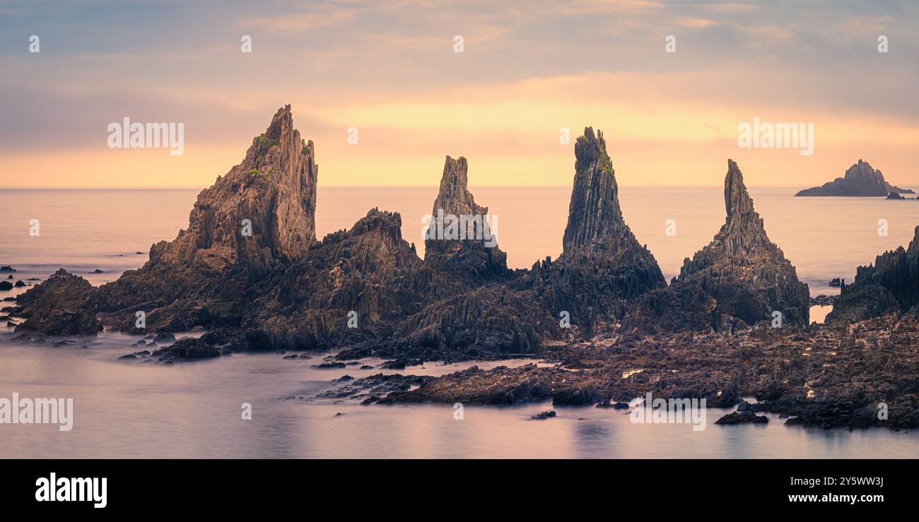 Sea stacks at sunrise on Gueirua Beach, a small pebbled bay that is ...