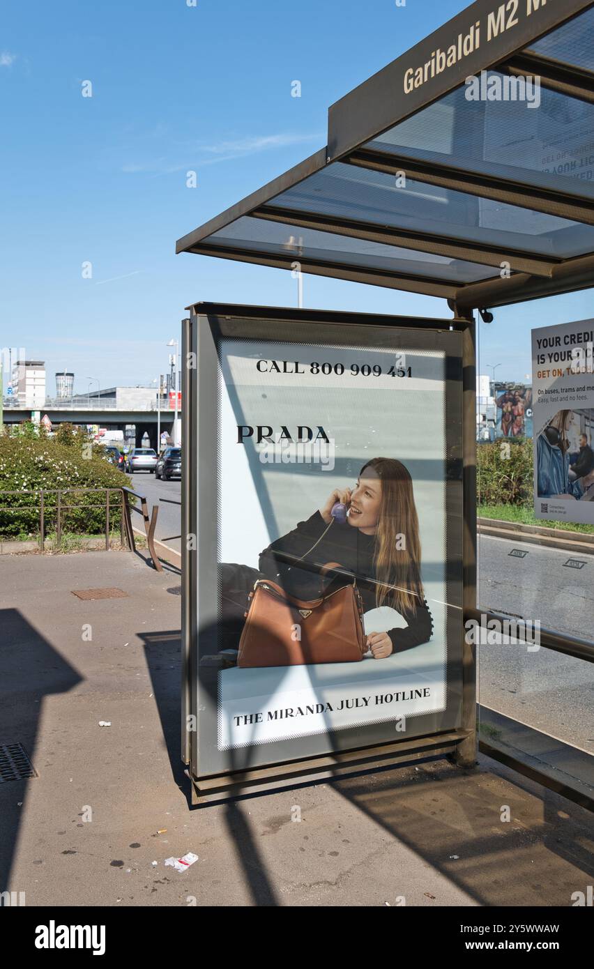 Prada billboard display at the tram stop, Milano, Italy fall 2024 Stock ...