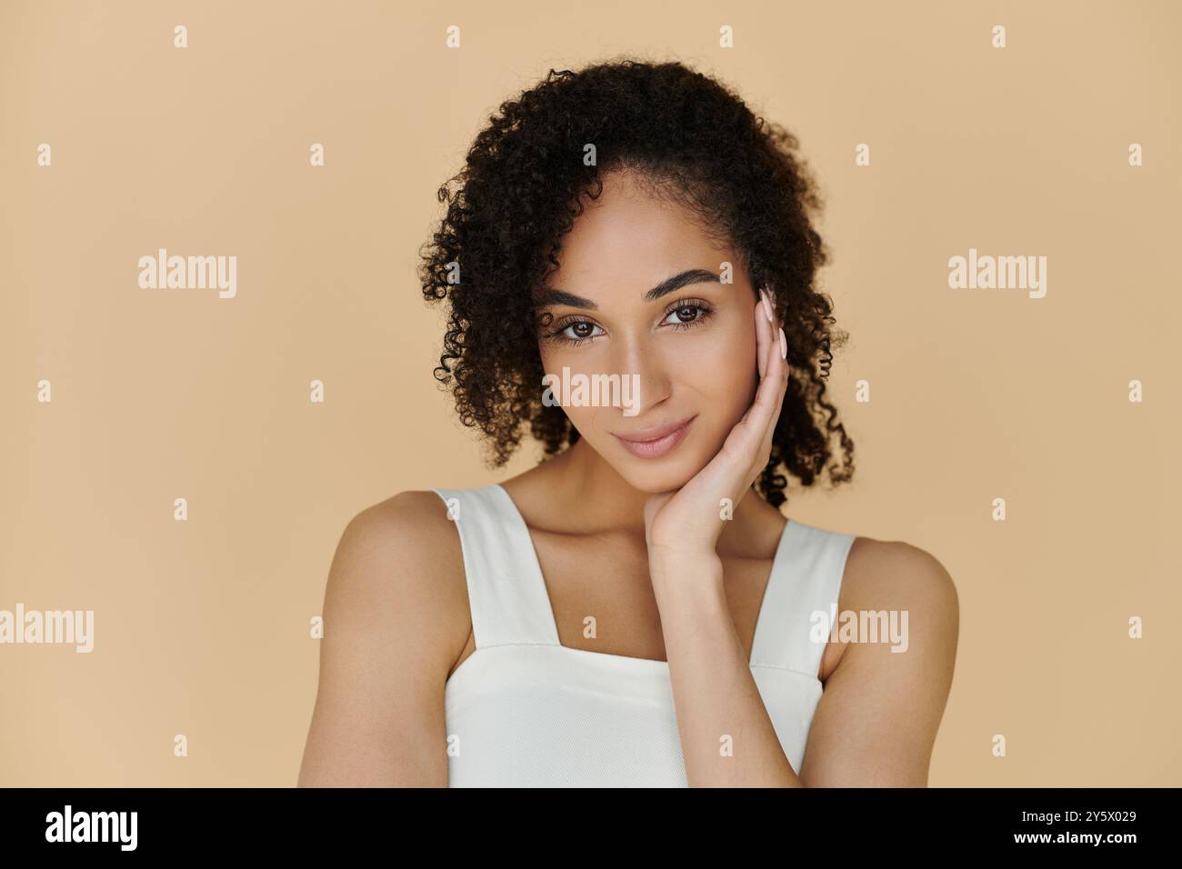 A fashionable woman exudes confidence with her chic outfit, captivating ...