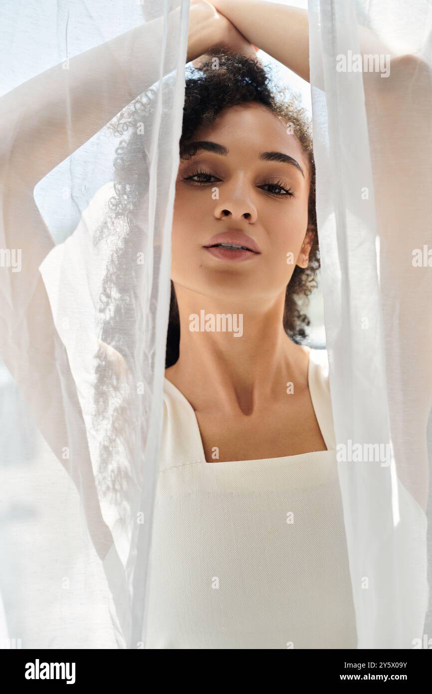 Woman behind sheer fabric hi-res stock photography and images - Alamy