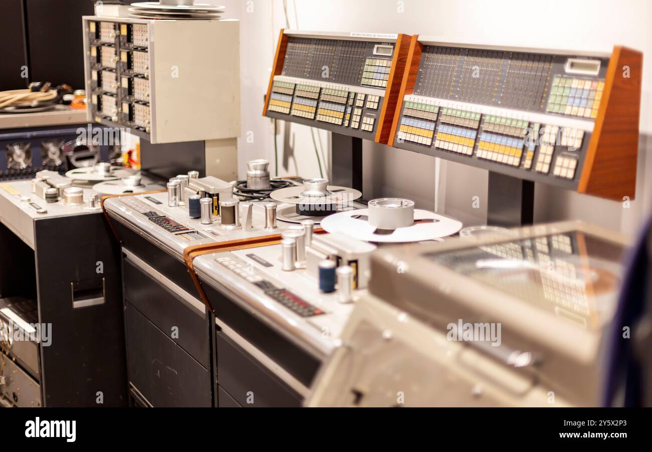 Vintage recording studio equipment with reel-to-reel tape machines and ...