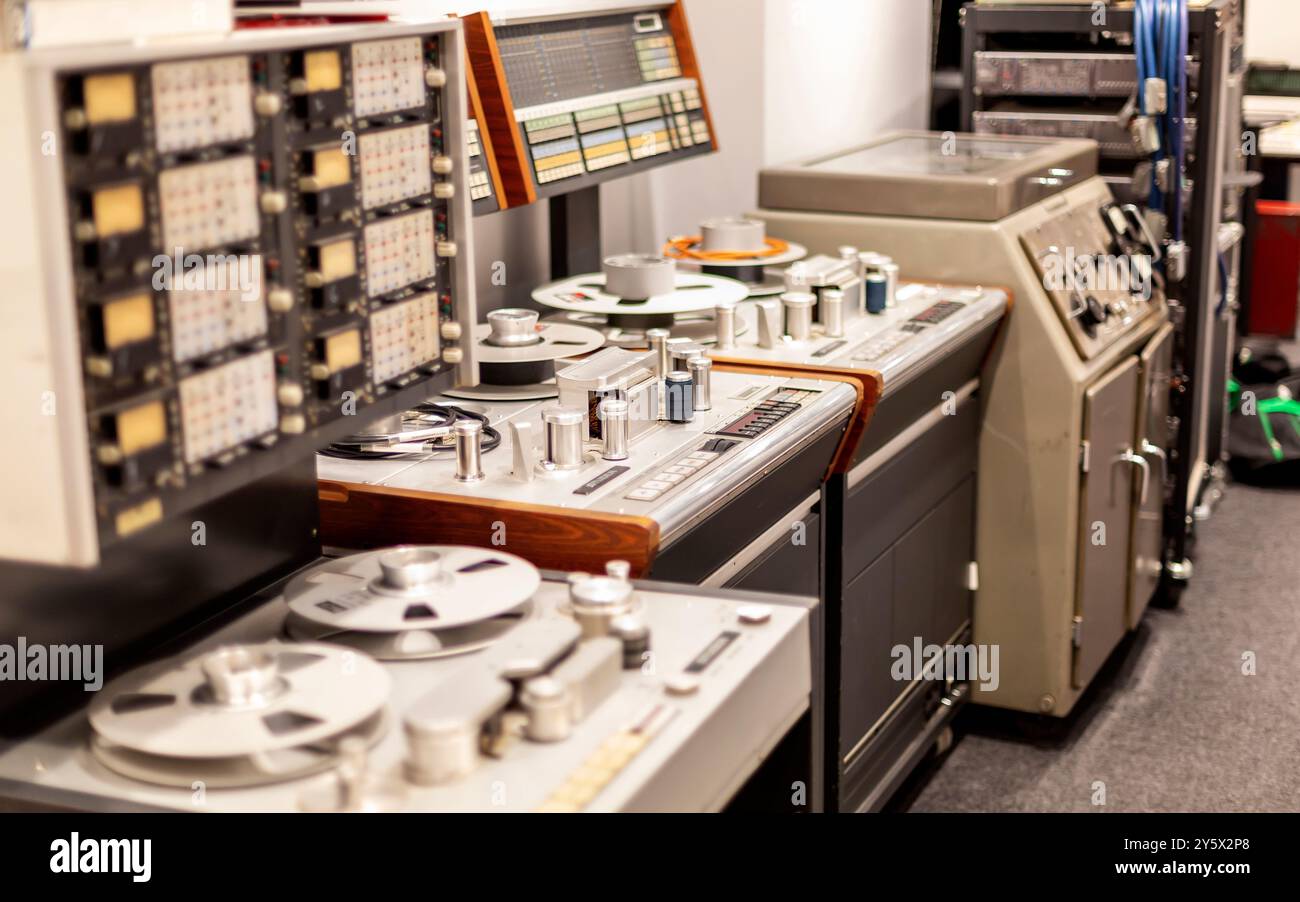 Vintage recording studio equipment with reel-to-reel tape machines and ...