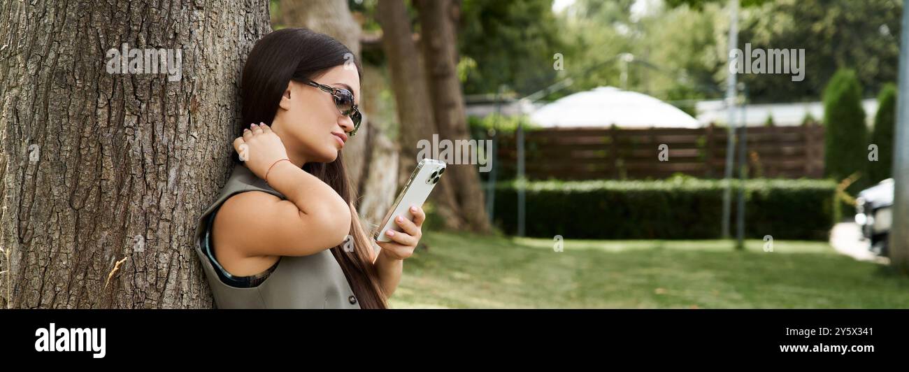 A cheerful brunette woman with short stature relaxes outside, leaning ...