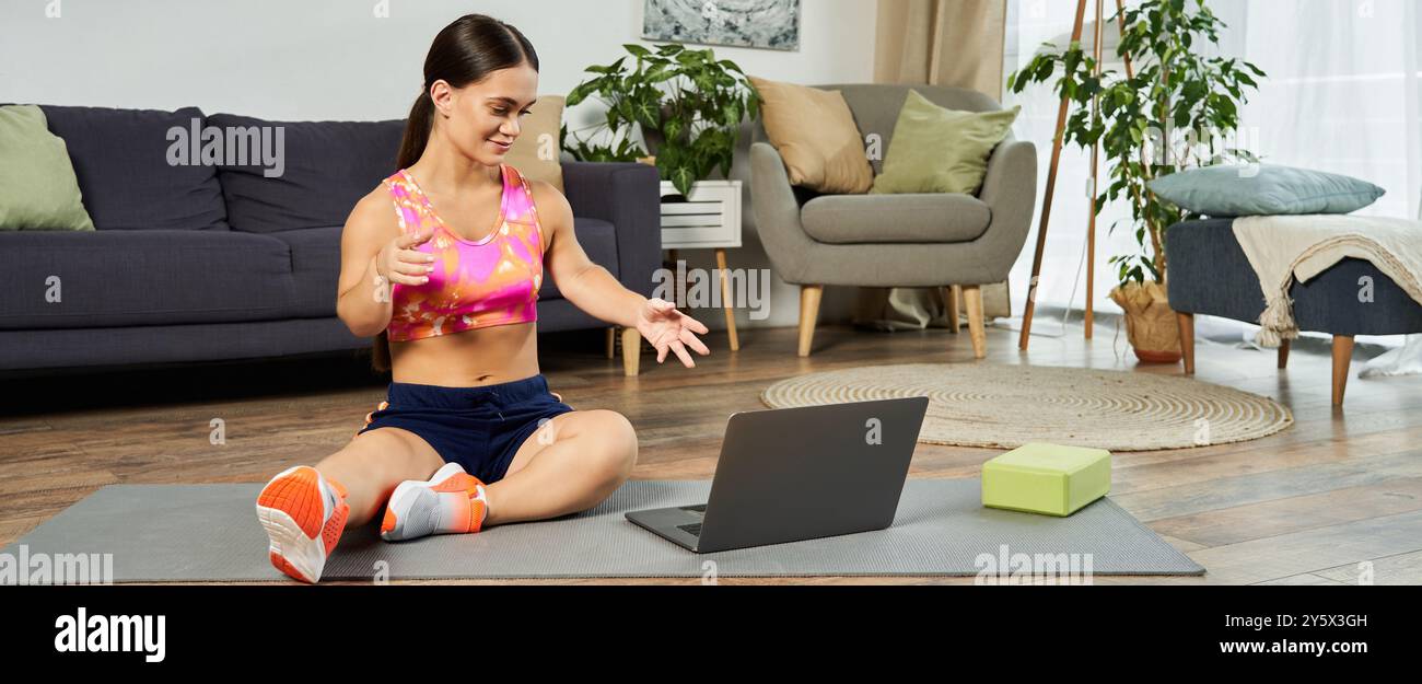 A young brunette woman with a short stature practices her workout routine at home, focused on ...