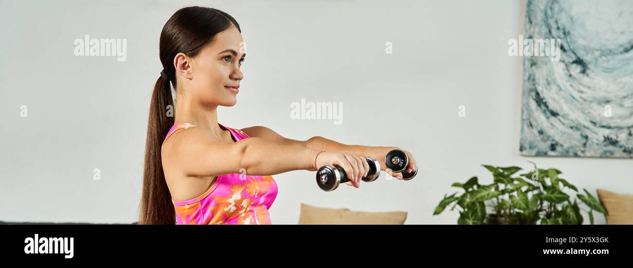 A dedicated brunette woman with a short stature is working out at home ...