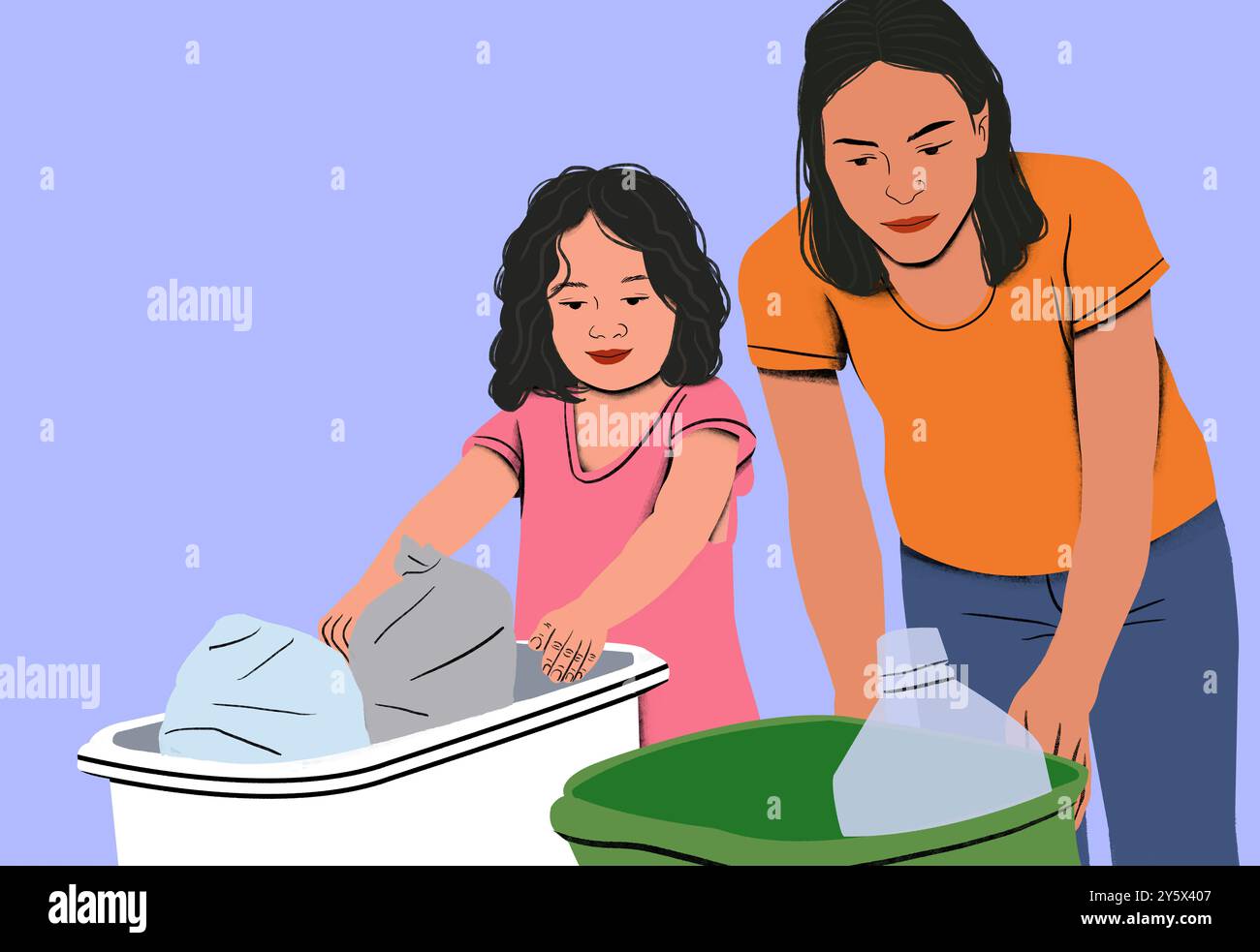 Mother and daughter doing laundry together with a girl learning to wash ...