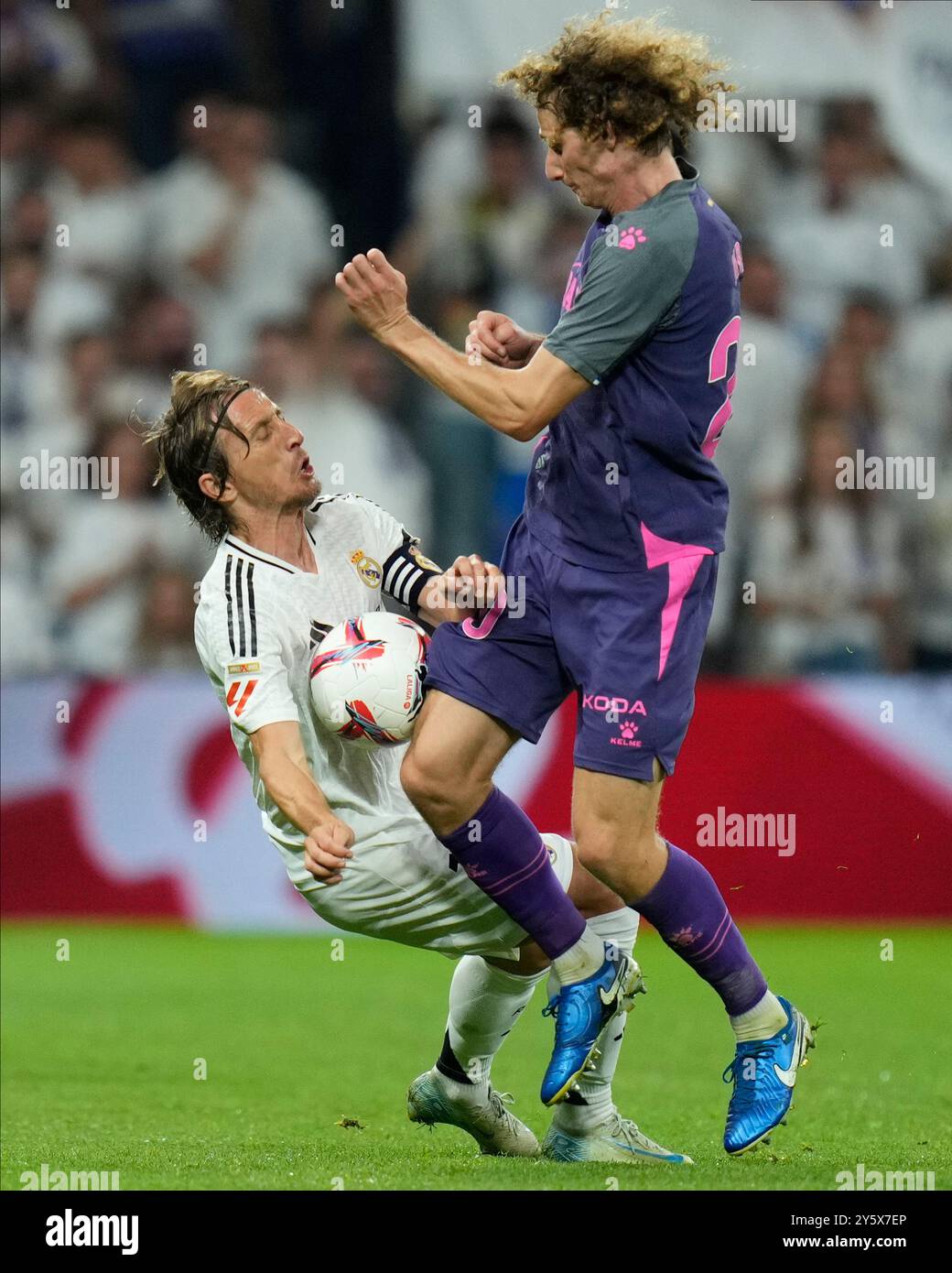 Madrid, Spain. 21st Sep, 2024. Luka Modric of Real Madrid CF and Alex ...
