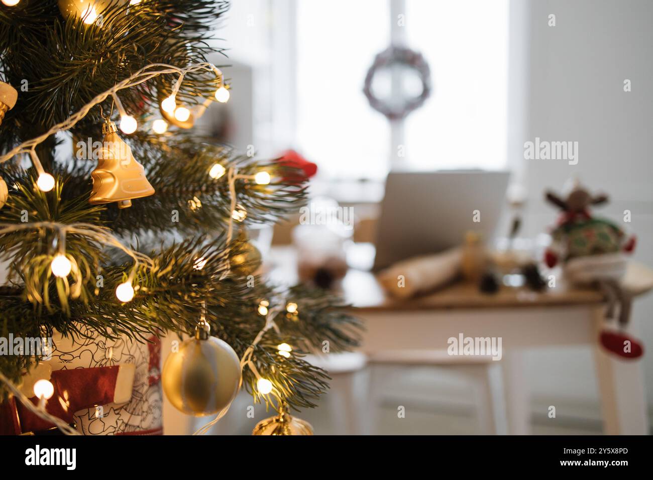 Cozy Christmas home setting with decorated Christmas tree Stock Photo ...