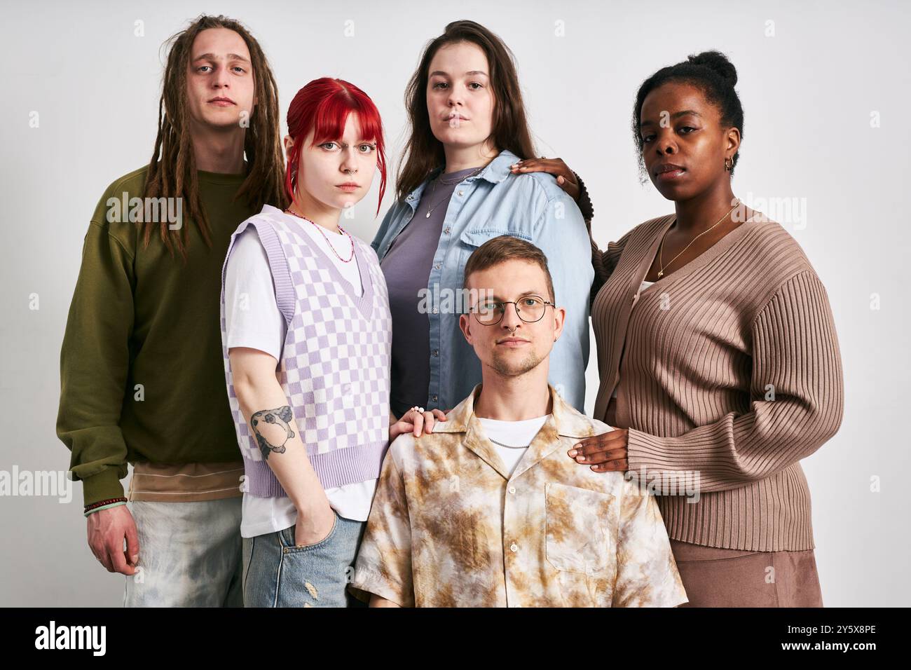 Portrait of group of five young adults of diverse ethnic backgrounds ...