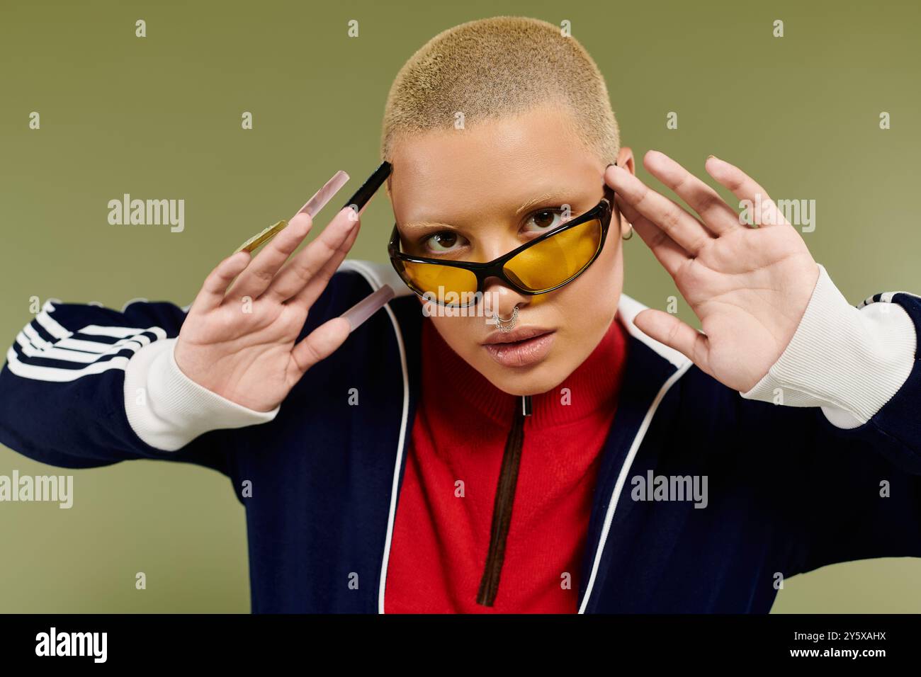 A young bald woman showcases her unique style with vibrant colors and ...