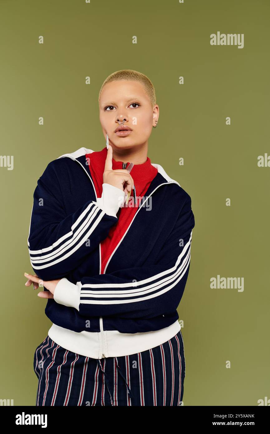 This unique individual showcases a bold expression while modeling ...