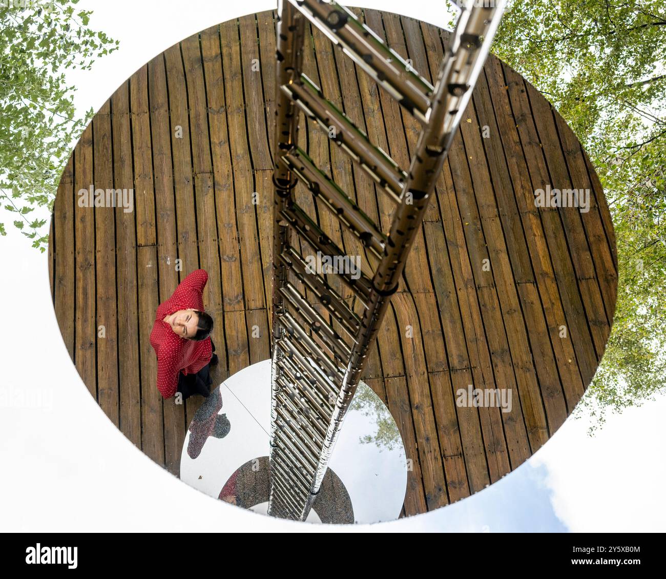 London, UK. 23 September 2024. A staff member with 'Ladder to Heaven ...