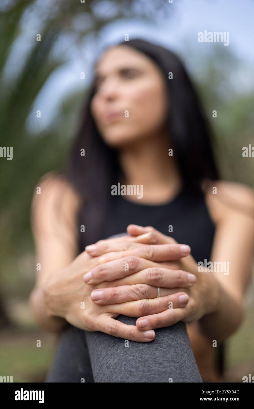 person with crossed hands, short and natural nails, parts of the human ...