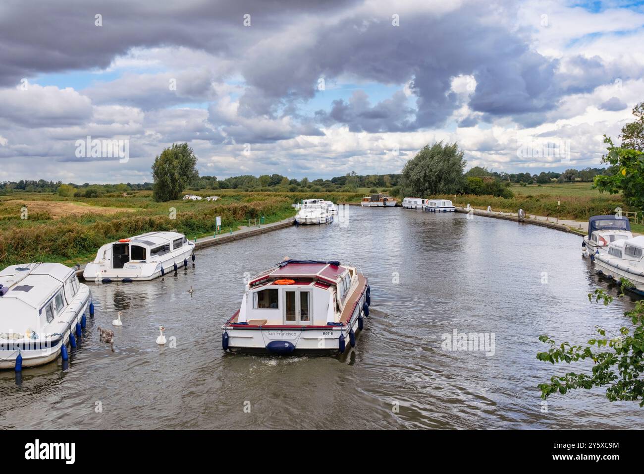 Boats moored on River Ant in Norfolk Broads National Park seen from ...
