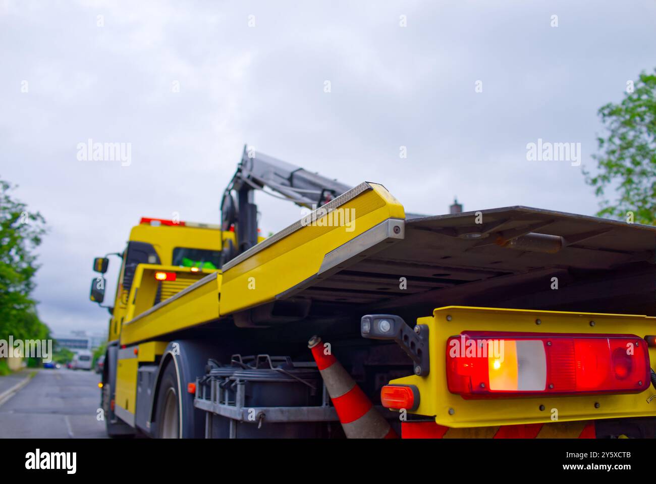view at the lower rear side and the red backlight of a yellow recovery ...