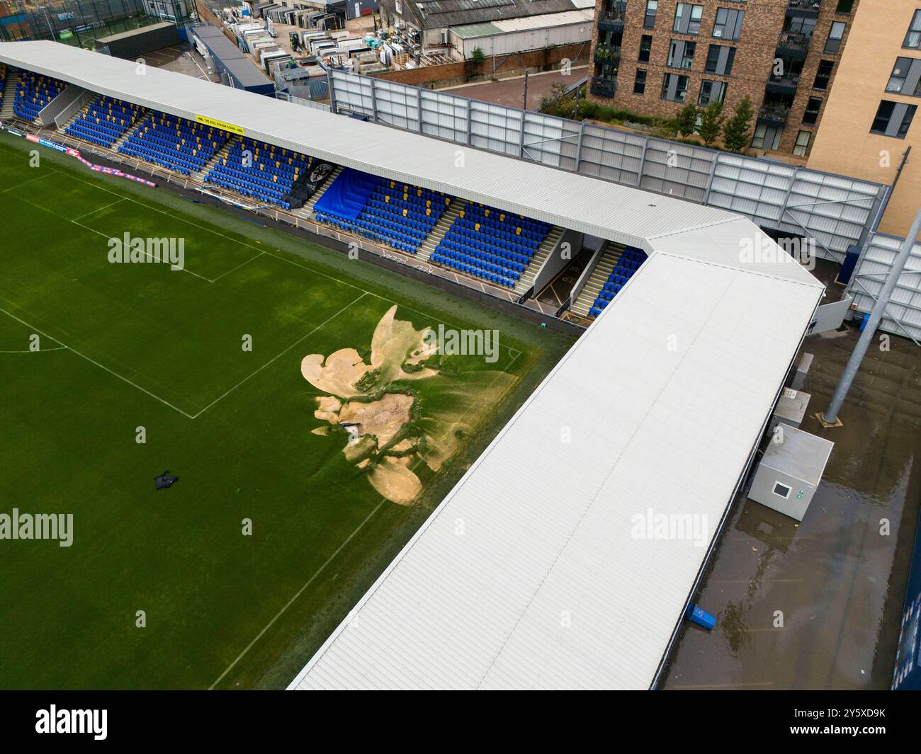 A sinkhole on the pitch and flooded walkways at the Cherry Red Records ...