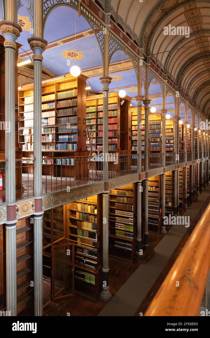 A beautiful historic library with ornate architecture and rows of ...