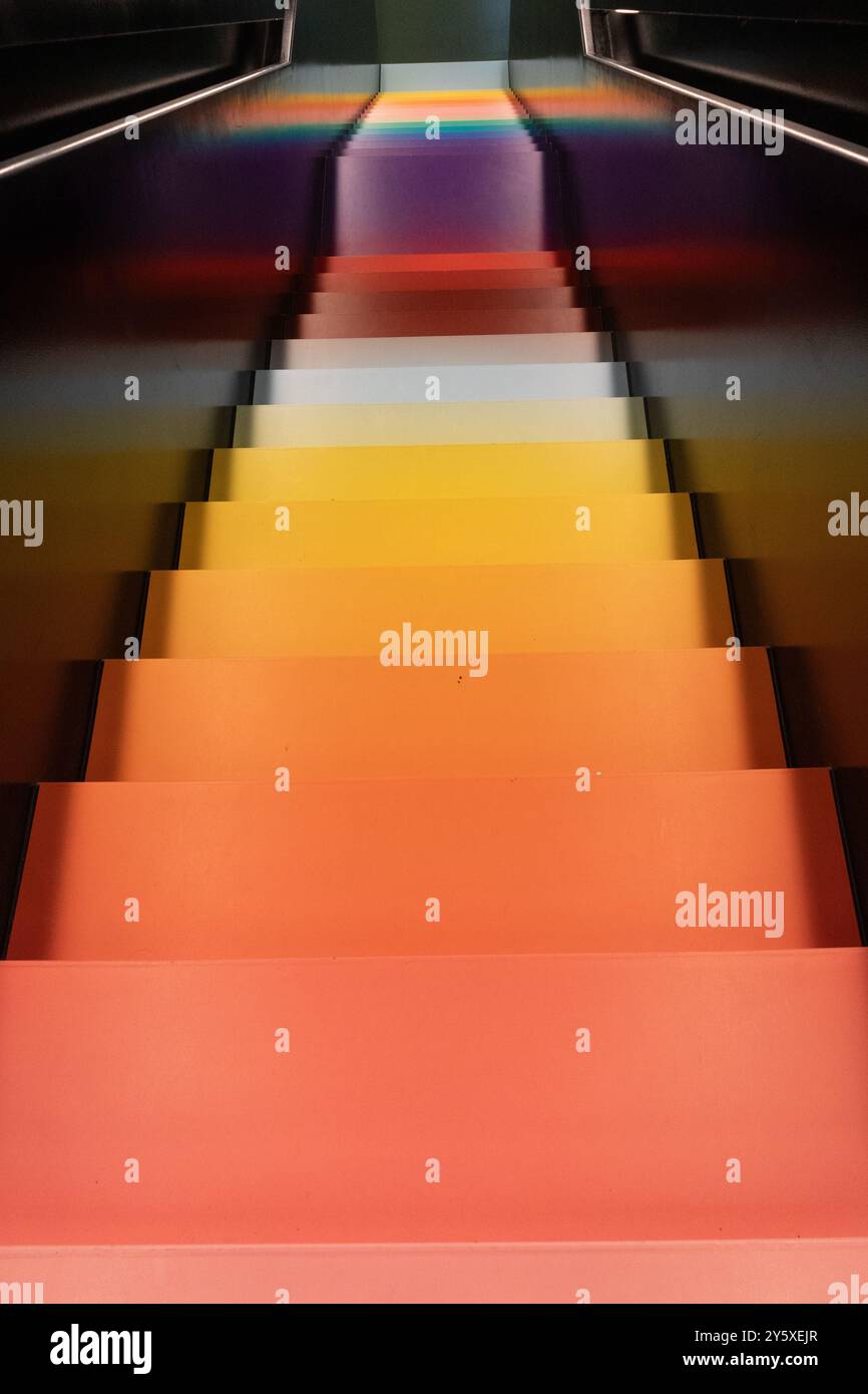 Colorful staircase with a gradient of rainbow hues, creating an eye ...
