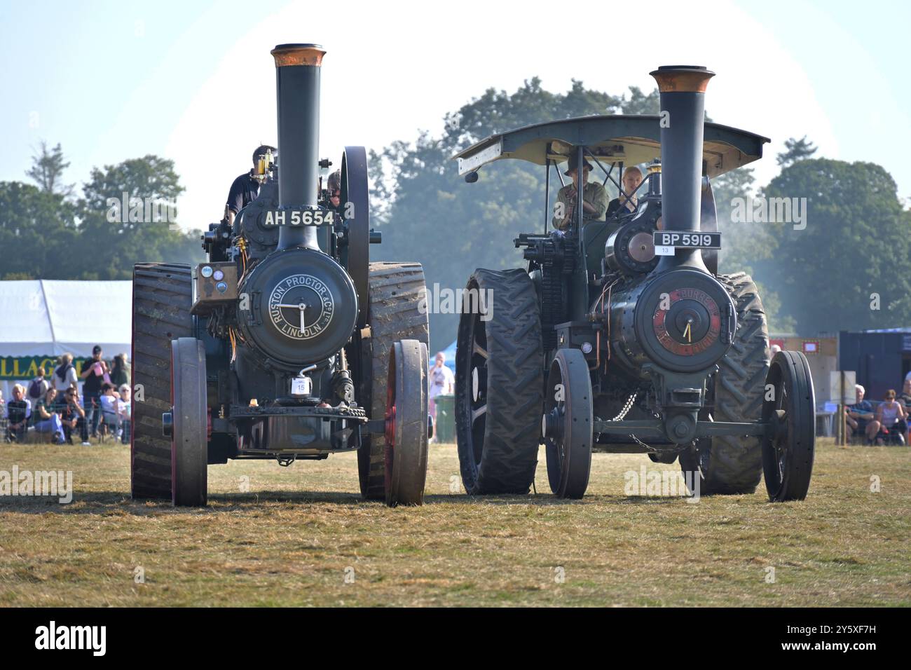 two vintage steam traction engines side by side in slow race, henham ...