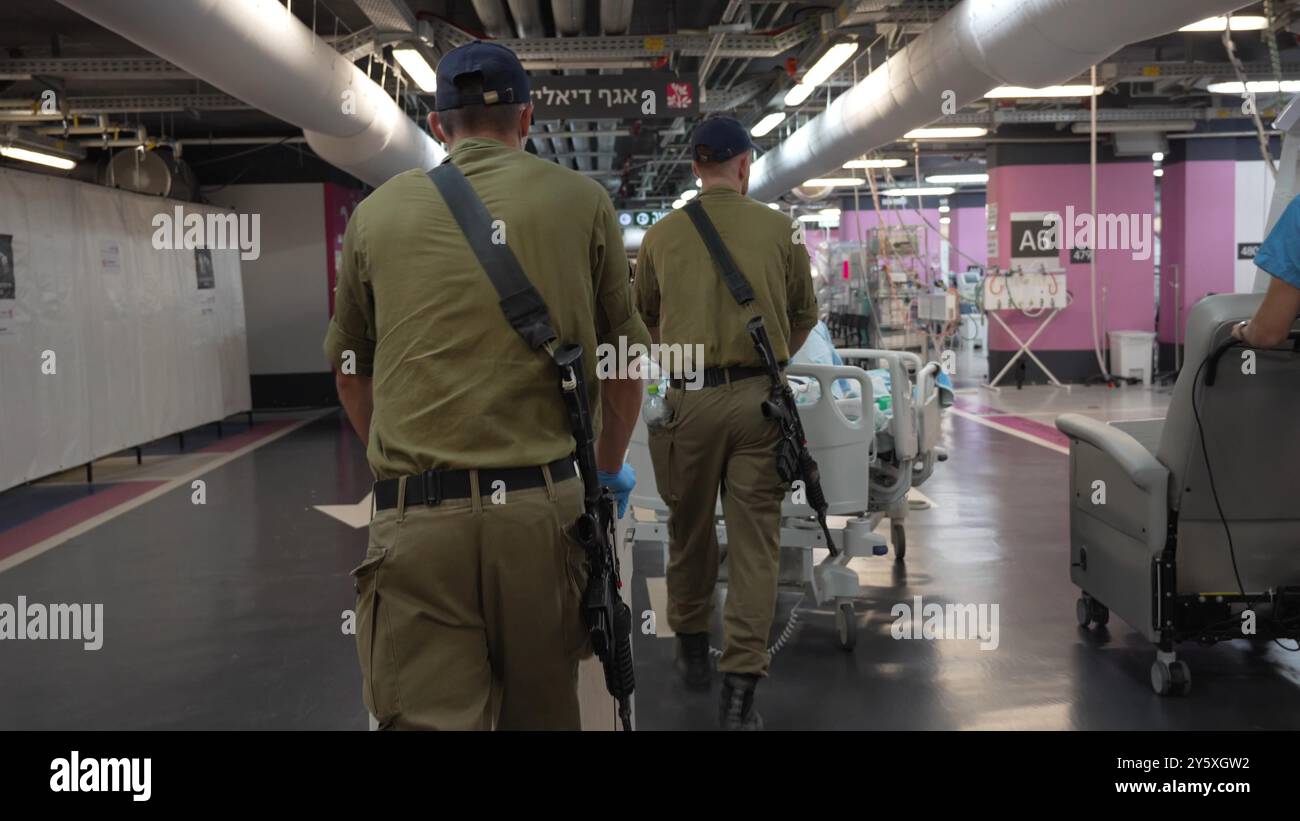 HAIFA, ISRAEL - SEPTEMBER 22: Israeli soldiers and hospital staff push ...