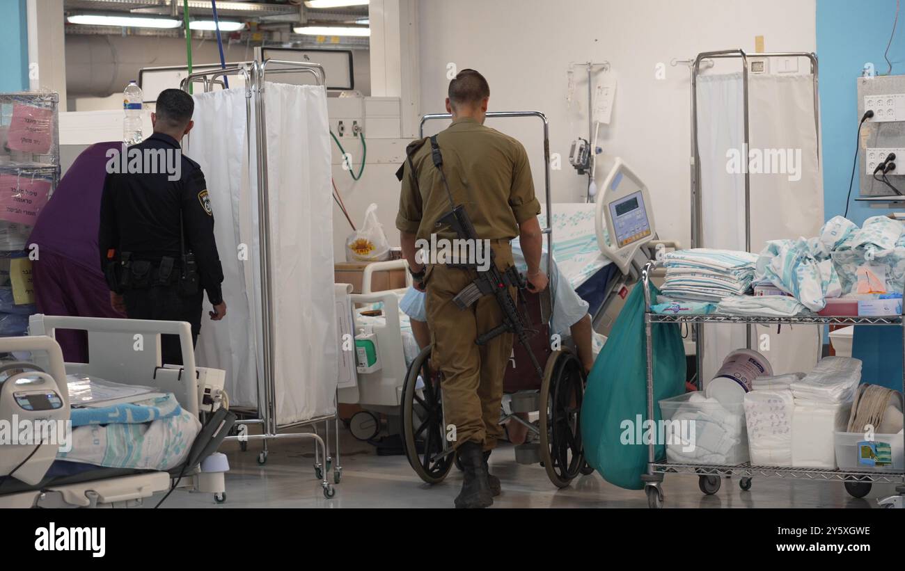 HAIFA, ISRAEL - SEPTEMBER 22: An Israeli soldier helps a patient at the ...