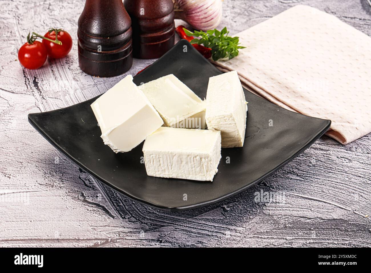 Greek traditional cuisine - Feta cheese bricks Stock Photo - Alamy