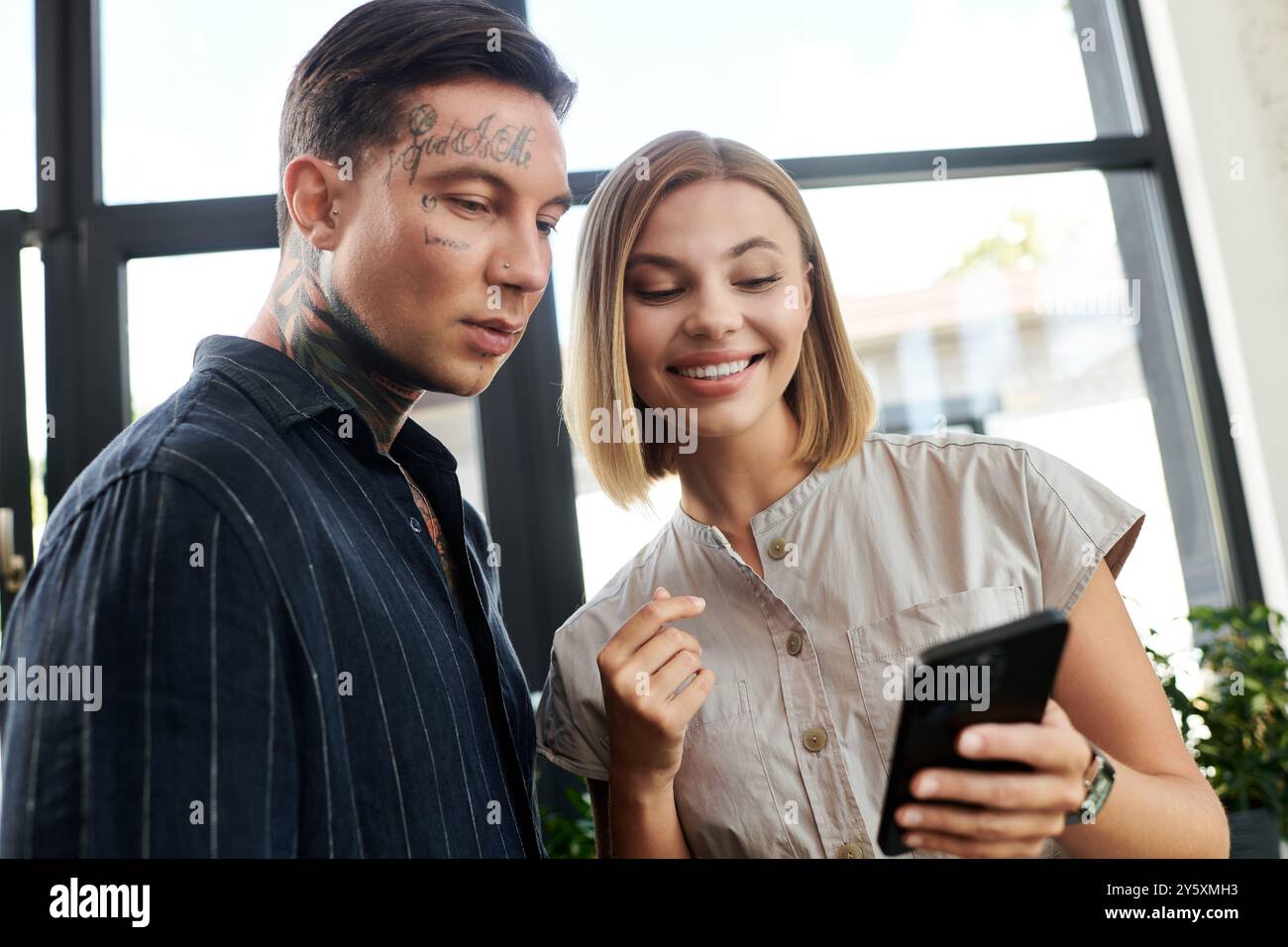 Two colleagues engage with enthusiasm, laughing and discussing on a ...