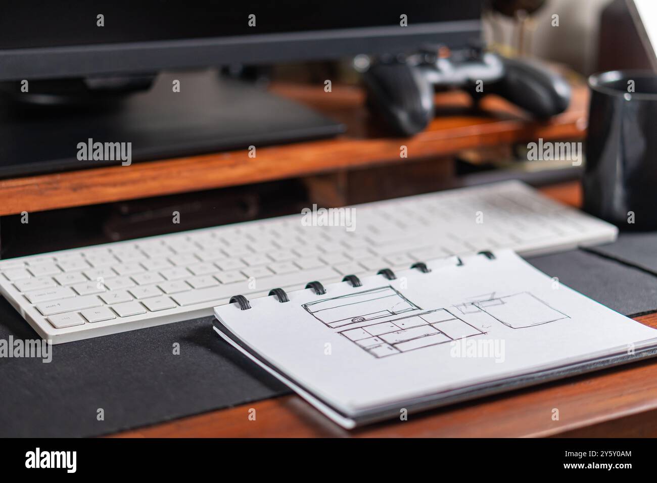A contemporary workspace setup with a computer monitor, keyboard ...