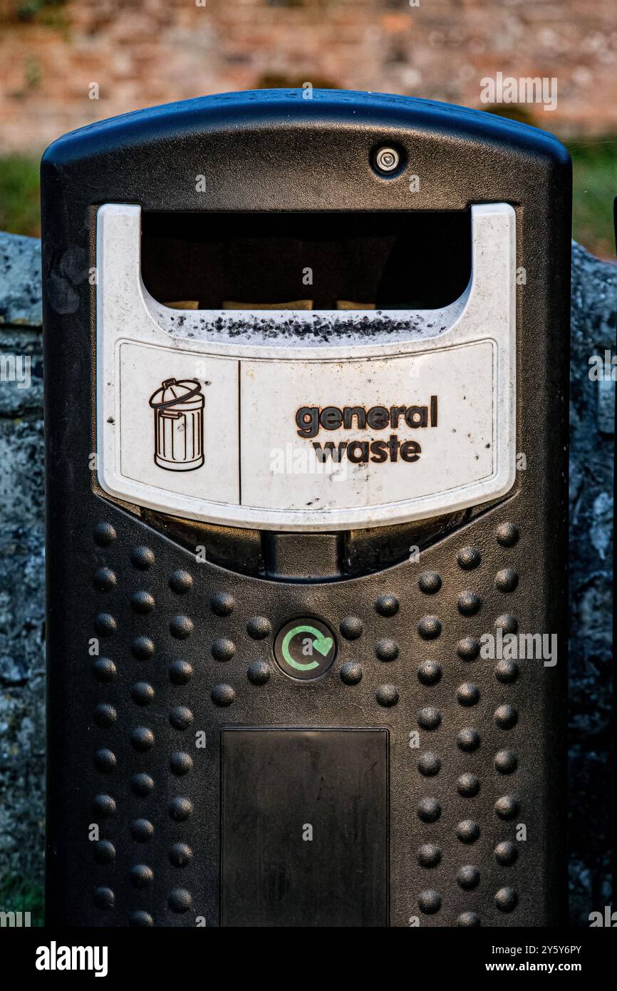 Recycling and general waste collection bins in a rural location. Credit ...