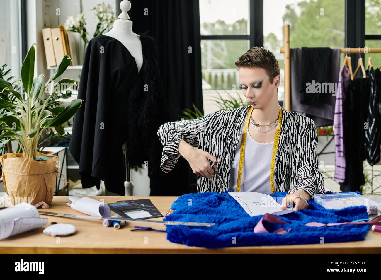 A fashion designer thoughtfully crafts garments in a lively studio ...