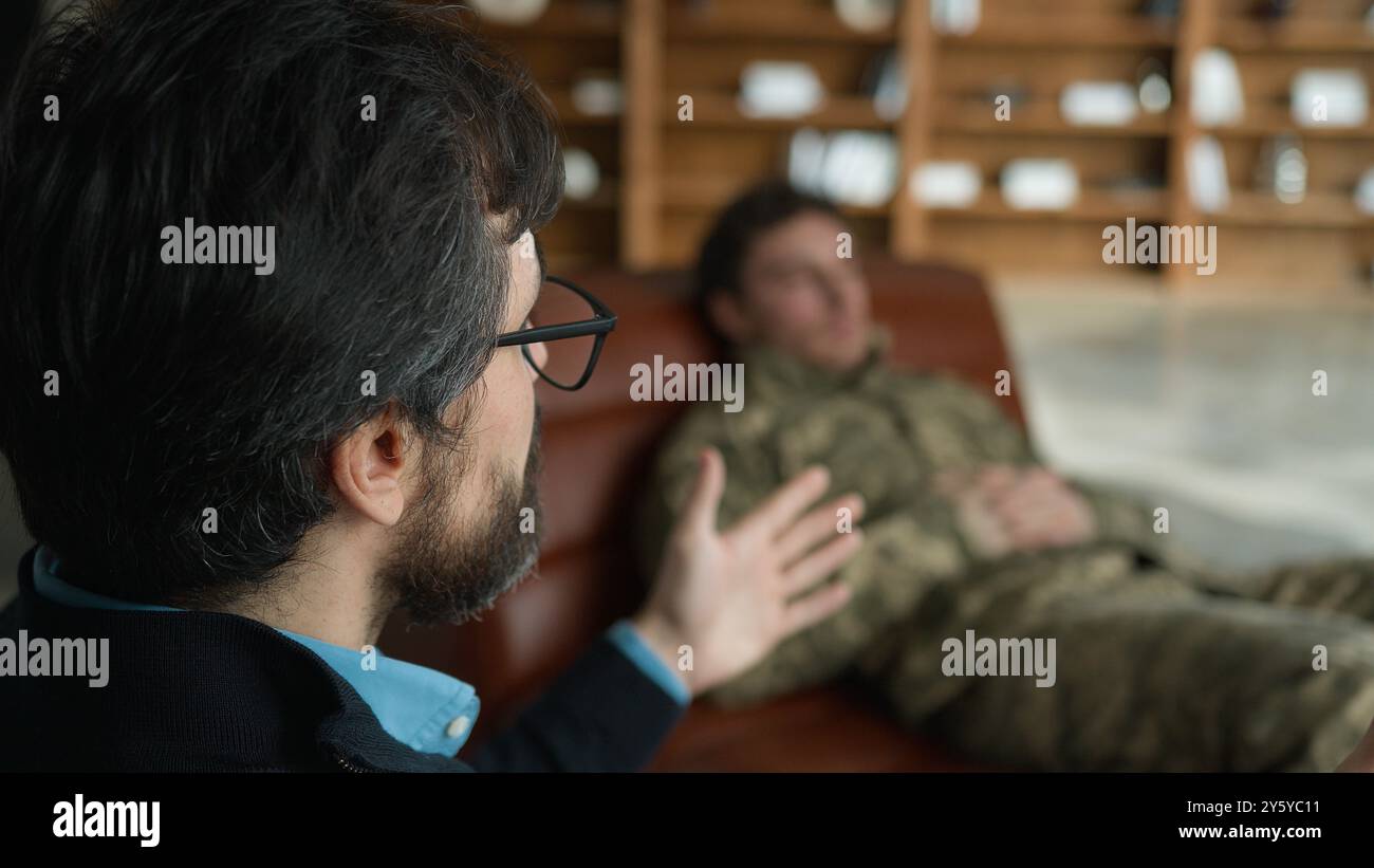 Middle aged Caucasian psychologist doctor man male speak talking to ...