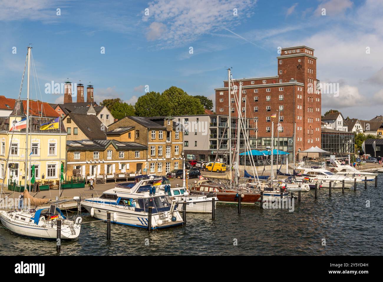 View of the harbor of Kappeln with towers of the Föh smokehouse and the ...